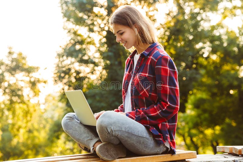 Amazing Lady Student Sitting in the Park Using Laptop Computer. Stock ...