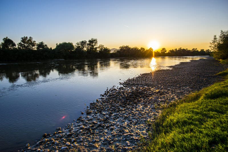 Sunshine rays on the river stock photo. Image of mountainstransalpina ...