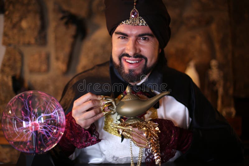Amazing Man Holding Genie Lamp Stock Photo - Image of ethnic, ball ...