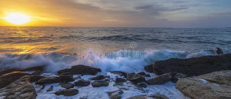 Sunset Over the Sea with Rocky Coast Stock Image - Image of evening ...
