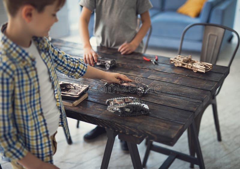 Active Boys Organizing Races on the Table while Being at Home Stock ...