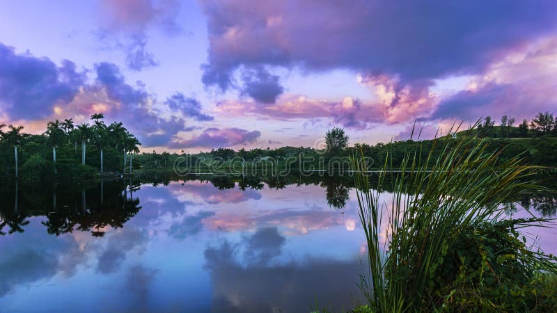 Amazing Reflective Lake during the Sunset Stock Image - Image of ...