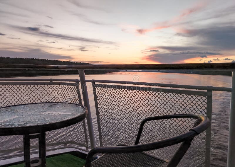 Amazing Romantic Sunset on the Ship Deck with Table and Chairs Stock ...