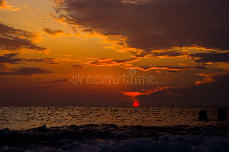 Amazing Sea Sunset on the Pebble Beach, the Sun, Waves, Clouds Stock ...