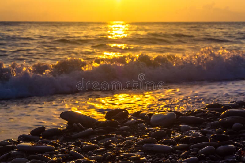 Amazing Sea Sunset on the Pebble Beach, the Sun, Waves, Clouds Stock ...