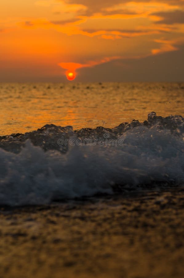 Amazing Sea Sunset on the Pebble Beach, the Sun, Waves, Clouds Stock ...