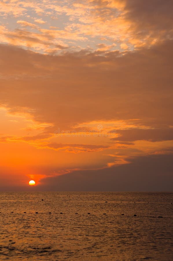 Amazing Sea Sunset on the Pebble Beach, the Sun, Waves, Clouds Stock ...