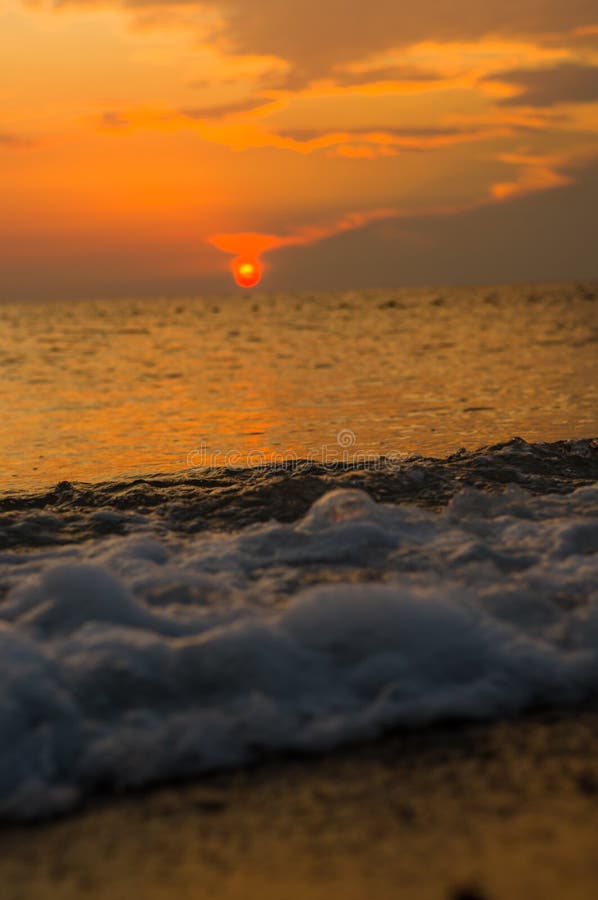 Amazing Sea Sunset on the Pebble Beach, the Sun, Waves, Clouds Stock ...