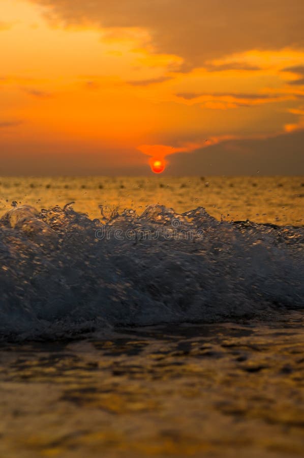 Amazing Sea Sunset on the Pebble Beach, the Sun, Waves, Clouds Stock ...
