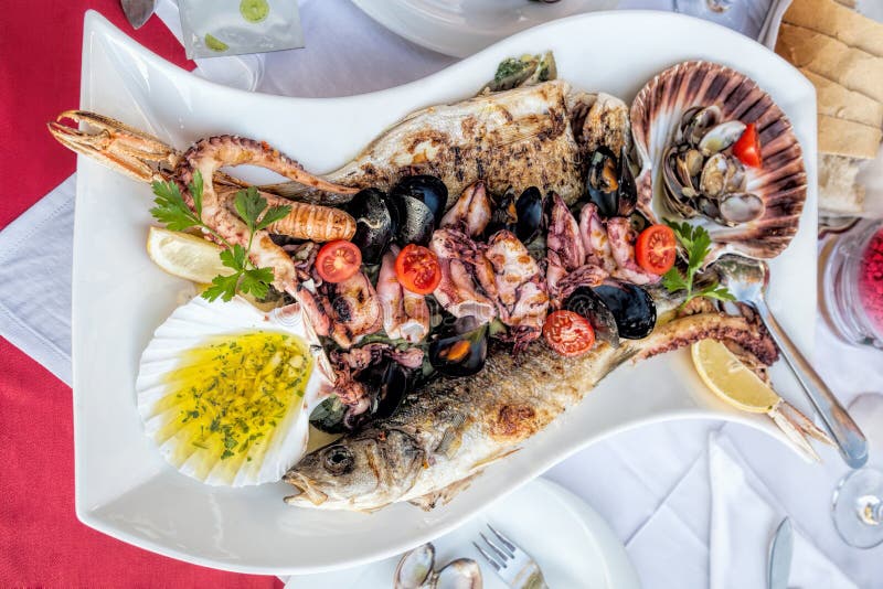 Amazing Seafood Plate with Fish, Scallops, Prawns, Octopus Stock Image ...