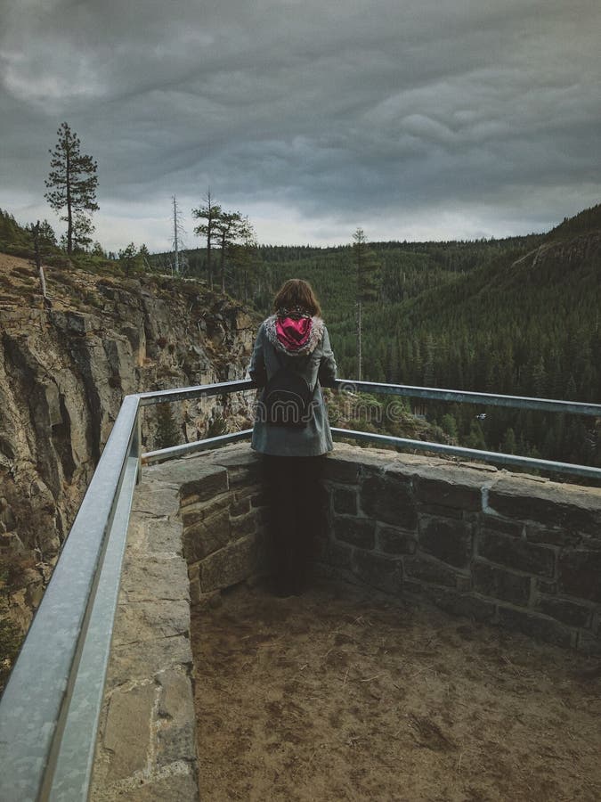 Amazing Shot of a Female Standing in a Viewpoint and Looking a ...
