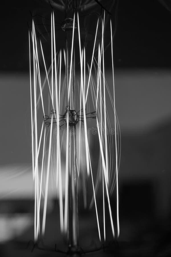 Electricity Current Inside a Retro Crystal Clear Light Bulb. Stock ...