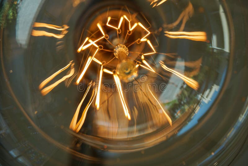 Electricity Current Inside a Retro Crystal Clear Light Bulb. Stock ...