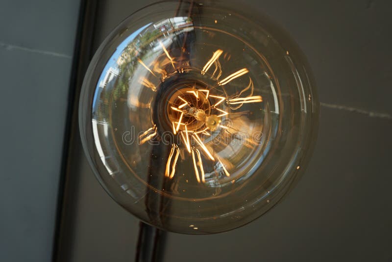 Electricity Current Inside a Retro Crystal Clear Light Bulb. Stock ...