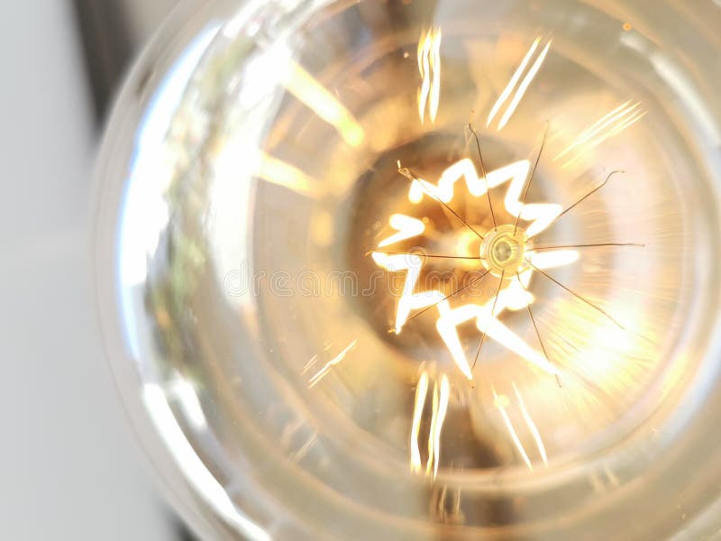 Electricity Current Inside a Retro Crystal Clear Light Bulb. Stock ...