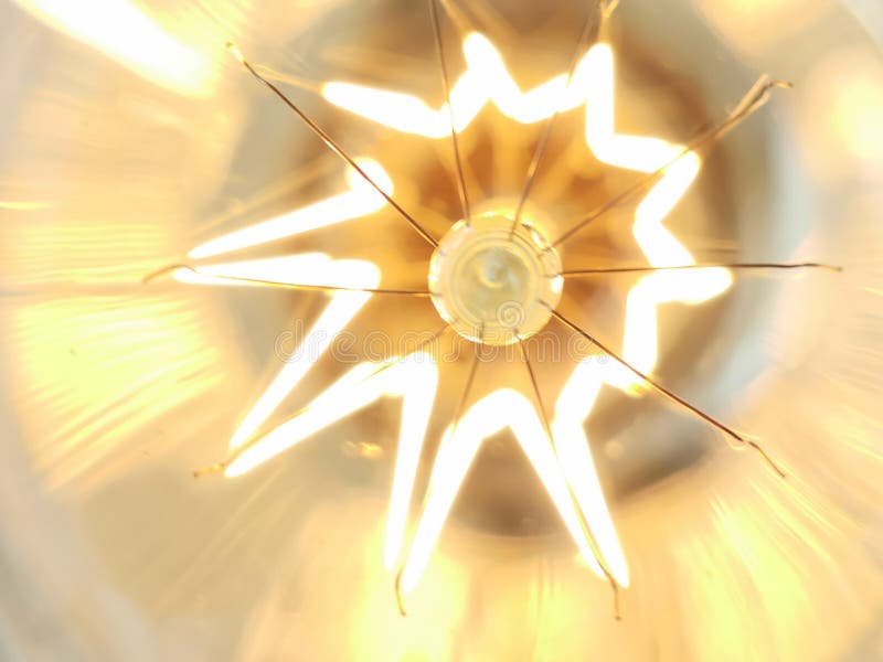Electricity Current Inside a Retro Crystal Clear Light Bulb. Stock ...