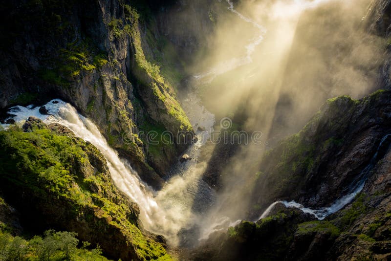 Amazing Sunbeams Passing through the Mist Created by the Voringfossen ...
