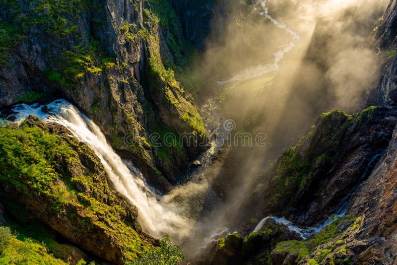 Amazing Sunbeams Passing through the Mist Created by the Voringfossen ...
