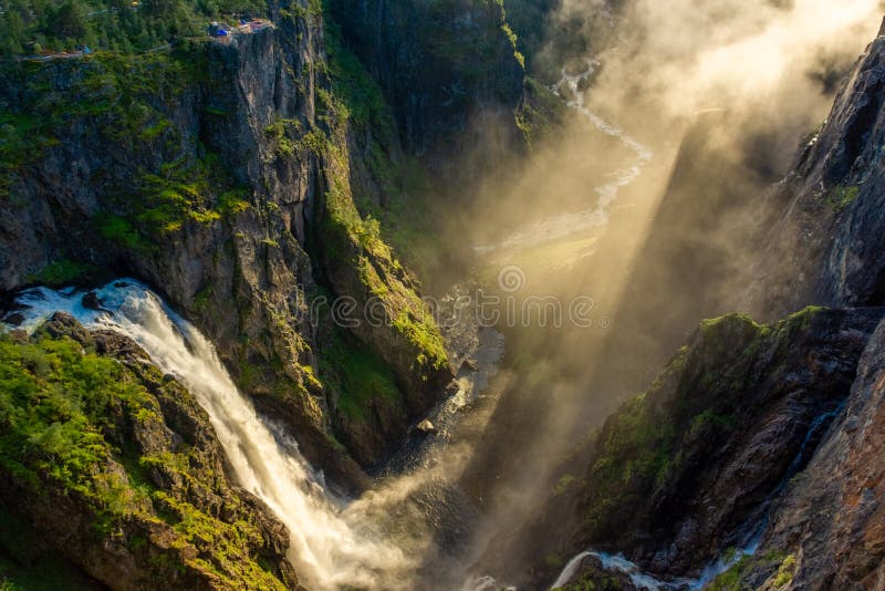 Amazing Sunbeams Passing through the Mist Created by the Voringfossen ...