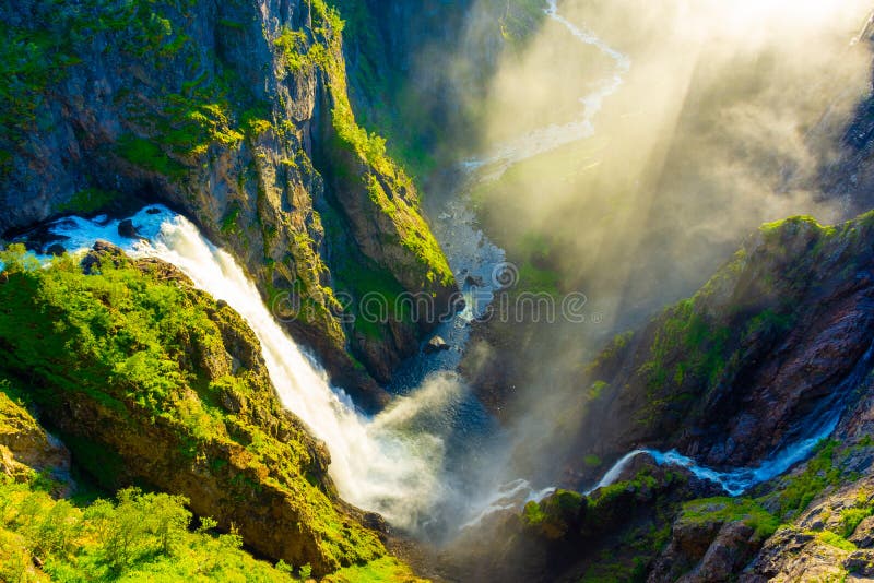 Amazing Sunbeams Passing through the Mist Created by the Voringfossen ...