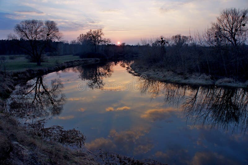 Amazing Sunset Over the River with a Mirror Reflection of Clouds in the ...