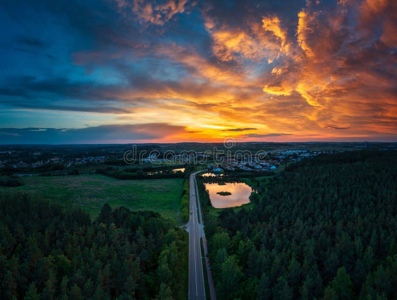 Amazing Sunset Over the Road through the Forest in Poland Stock Photo ...