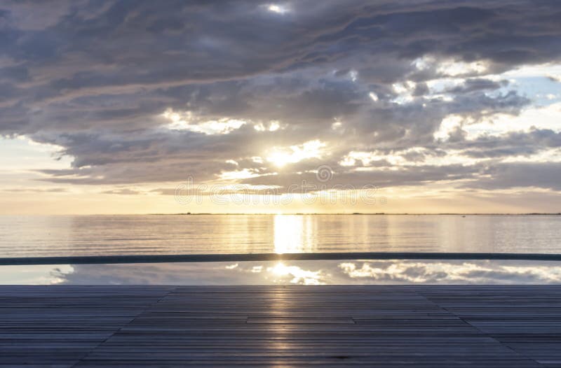 Amazing Sunset Over the Sea with Dramatic Clouds Pool Reflection Stock ...