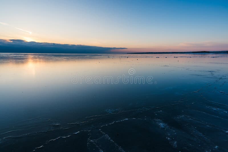 Amazing View of the Frozen Lake at Sunset. Delightful Evening Landscape ...