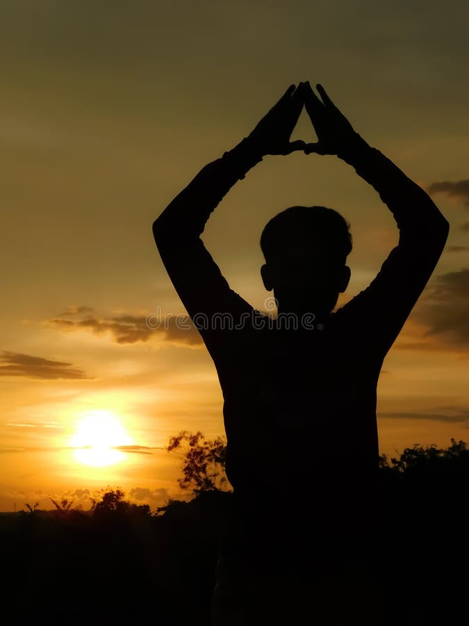 View of Sunset with a Shadow of a Man Doing Yoga Stock Photo - Image of ...
