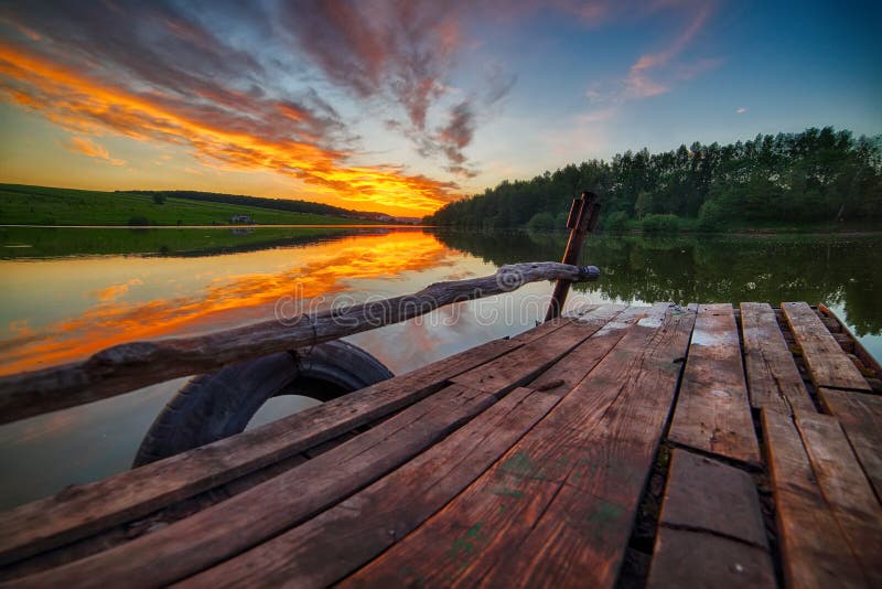 Amazing Wooden Dock, Pier, on a Lake in the Evening Stock Image - Image ...