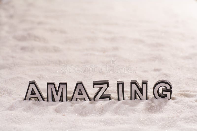 Amazing word on white sand stock image. Image of shiny - 119346031