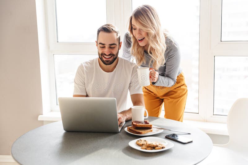 Amazing Young Loving Couple Sitting at the Kitchen Have a Breakfast ...