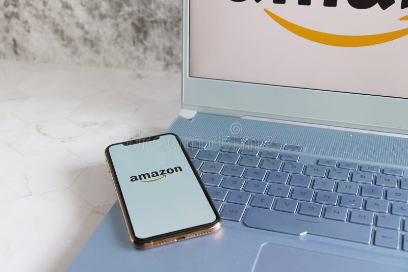 Amazon Logo on Computer Screen and Amazon Logo on Mobile Phone Screen ...