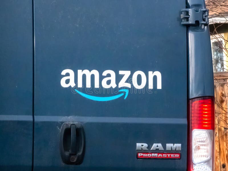 An Amazon Logo, Emblazoned on the Side of a Blue Delivery Van ...
