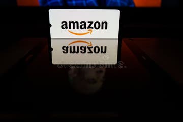 Amazon Logo on Screen and Jeff Bezos is a Executive Chairman of Amazon ...