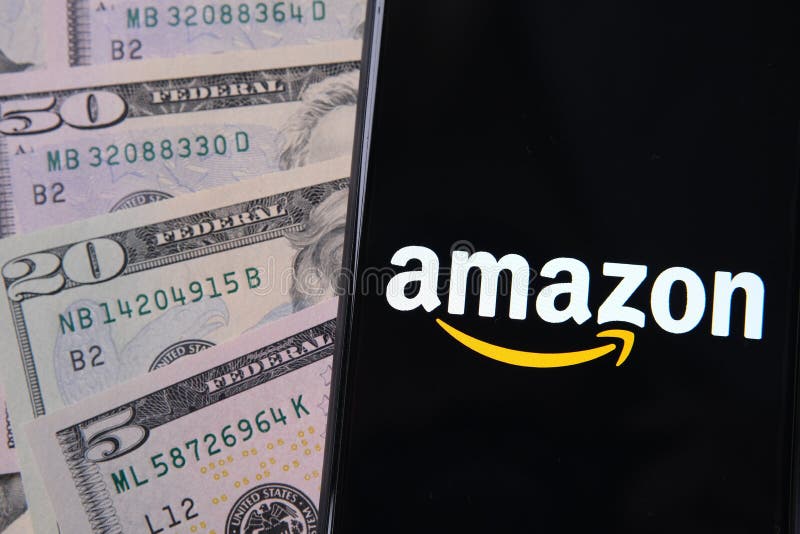 Amazon Logo on Smartphone Placed Next To Dollar Banknotes Editorial ...