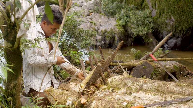 Indigenous building a raft stock footage. Video of construction - 158924996