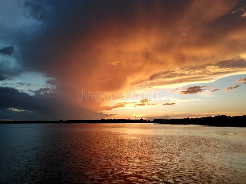 Amber Bayside Sunset Under a Cloud Stock Photo - Image of reflection, golden: 227888038