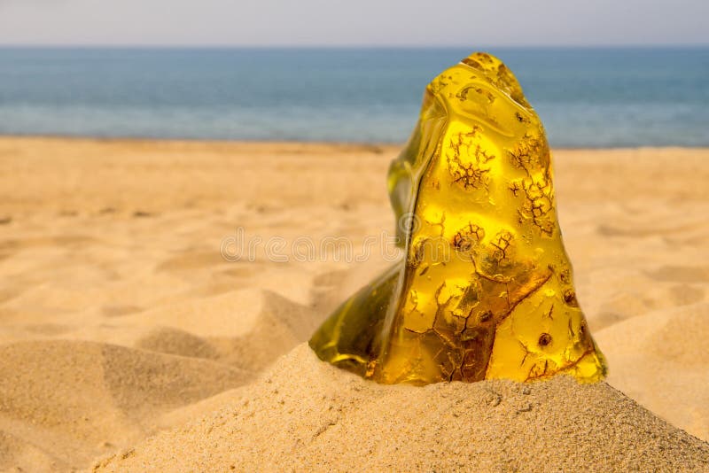 Amber on a beach stock photo. Image of translucent, gemstone - 73545798