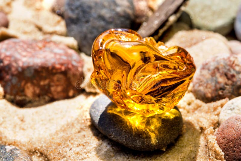 Amber on a beach stock photo. Image of beach, orange - 93395196