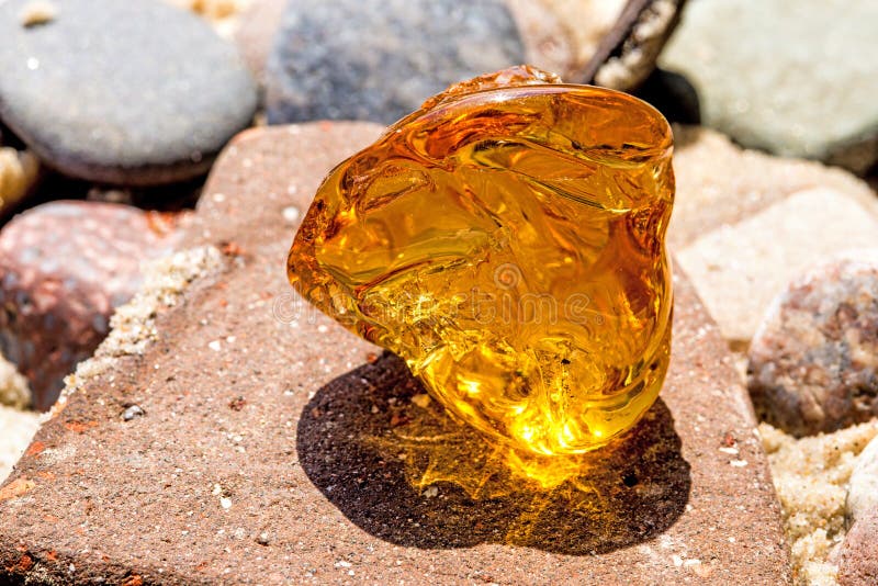 Amber on a beach stock image. Image of pebbels, natural - 93395293