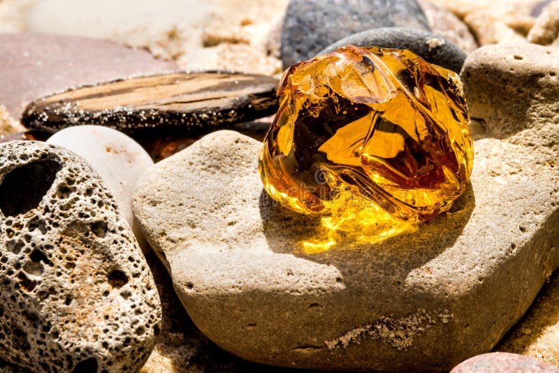 Amber on a beach stock photo. Image of crystal, decoration - 93526818