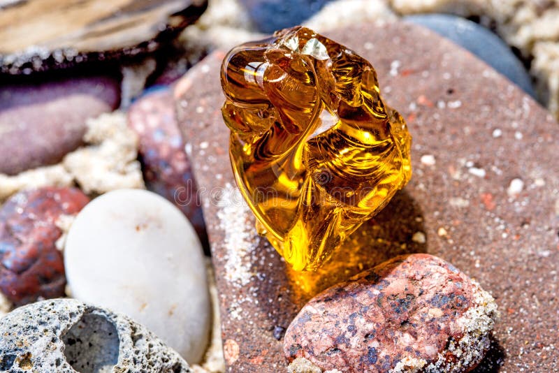 Amber on a beach stock photo. Image of bright, shiny - 94229782