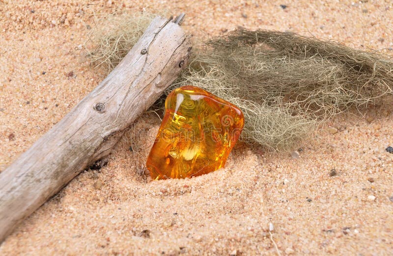 Amber on a beach stock photo. Image of precious, geology - 93667842