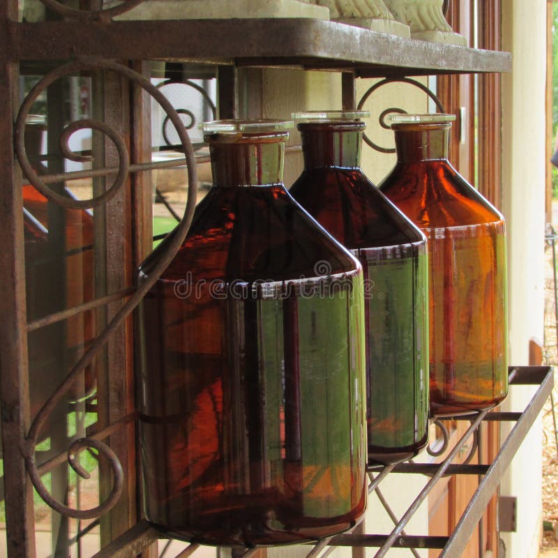 Amber Glass Medicine Bottles on Rack in Pharmacy Stock Image - Image of ...