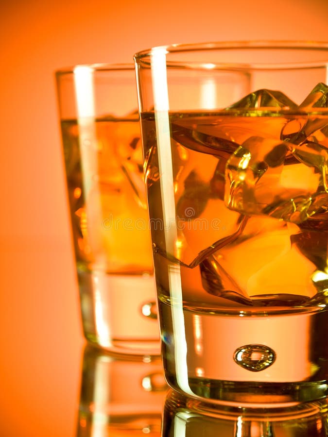 Amber drink stock image. Image of indoors, glass, rocks - 24721969