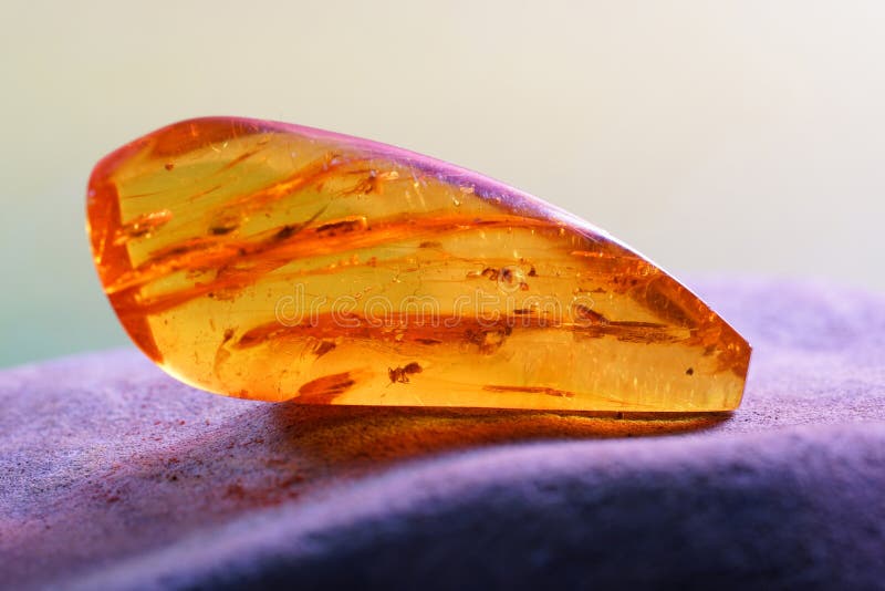 Amber Gemstone on Pink and Blue Background. Shallow Depth a Field Stock ...