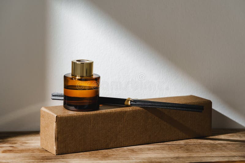 Elegant Reed Diffuser with Shadows on Wooden Surface in Soft Morning ...
