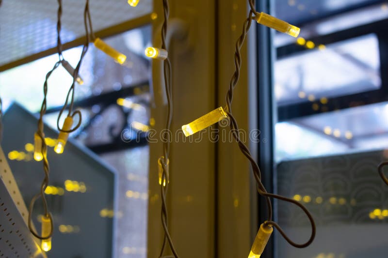 Amber Lights Hanging from a Window, Creating a Beautiful Display of ...