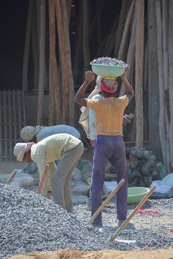 Construction Labour Working at Construction Site Carrying Brick Cement ...